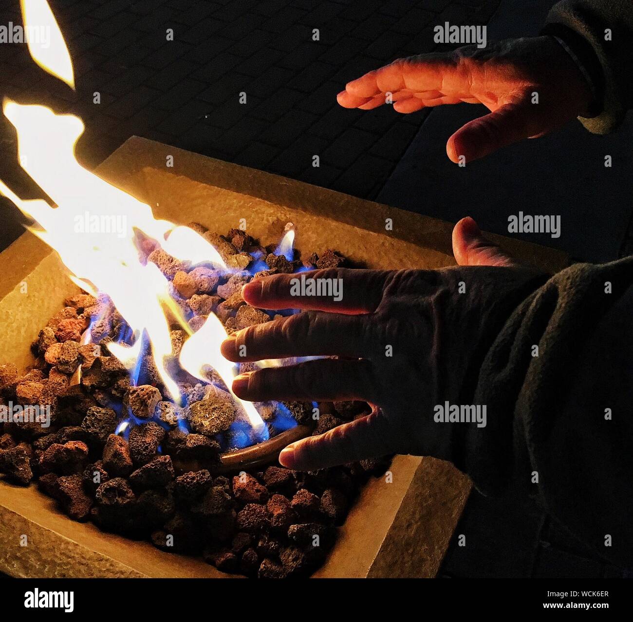 Warming Hands By Fire High Resolution Stock Photography and Images - Alamy