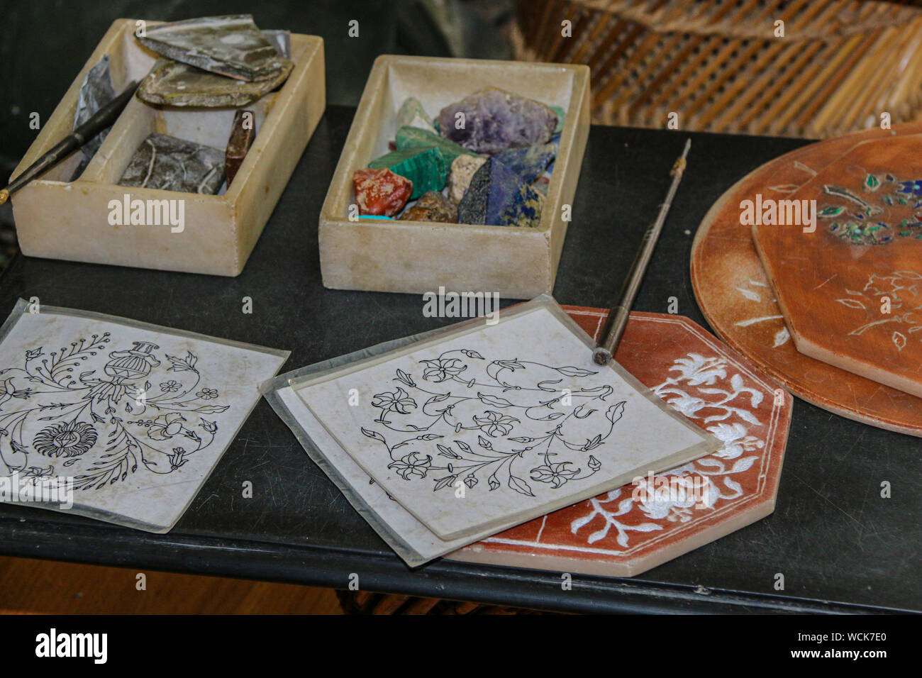 Craftsman employing traditional techniques and shaping pieces of marble ...