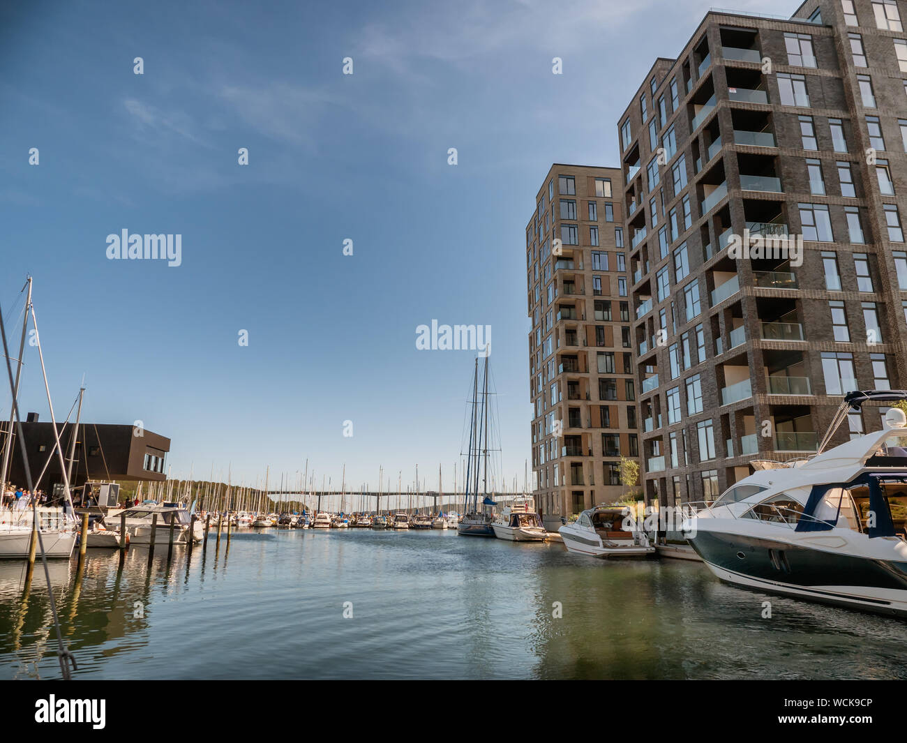 Vejle inner marina harbor with modern apartments and small boats ...