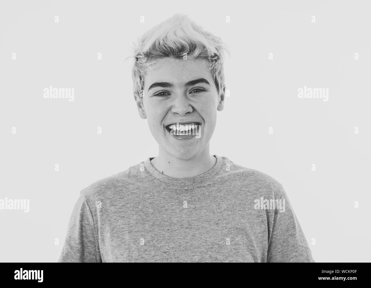 Portrait of handsome young transgender teenager man with beautiful ...