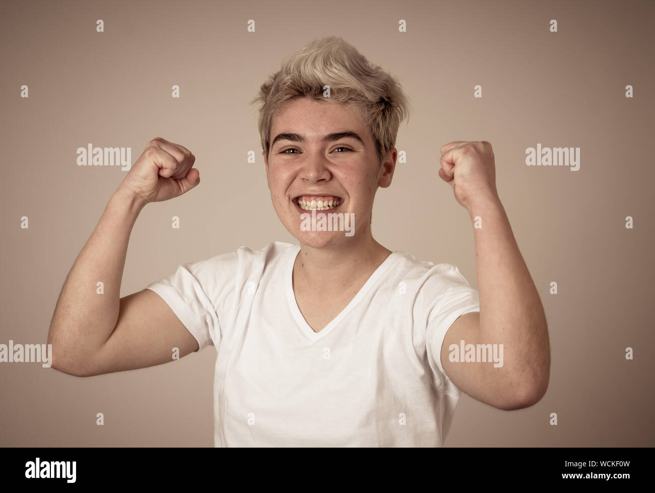 Portrait of young happy and excited transgender teen happy and excited ...