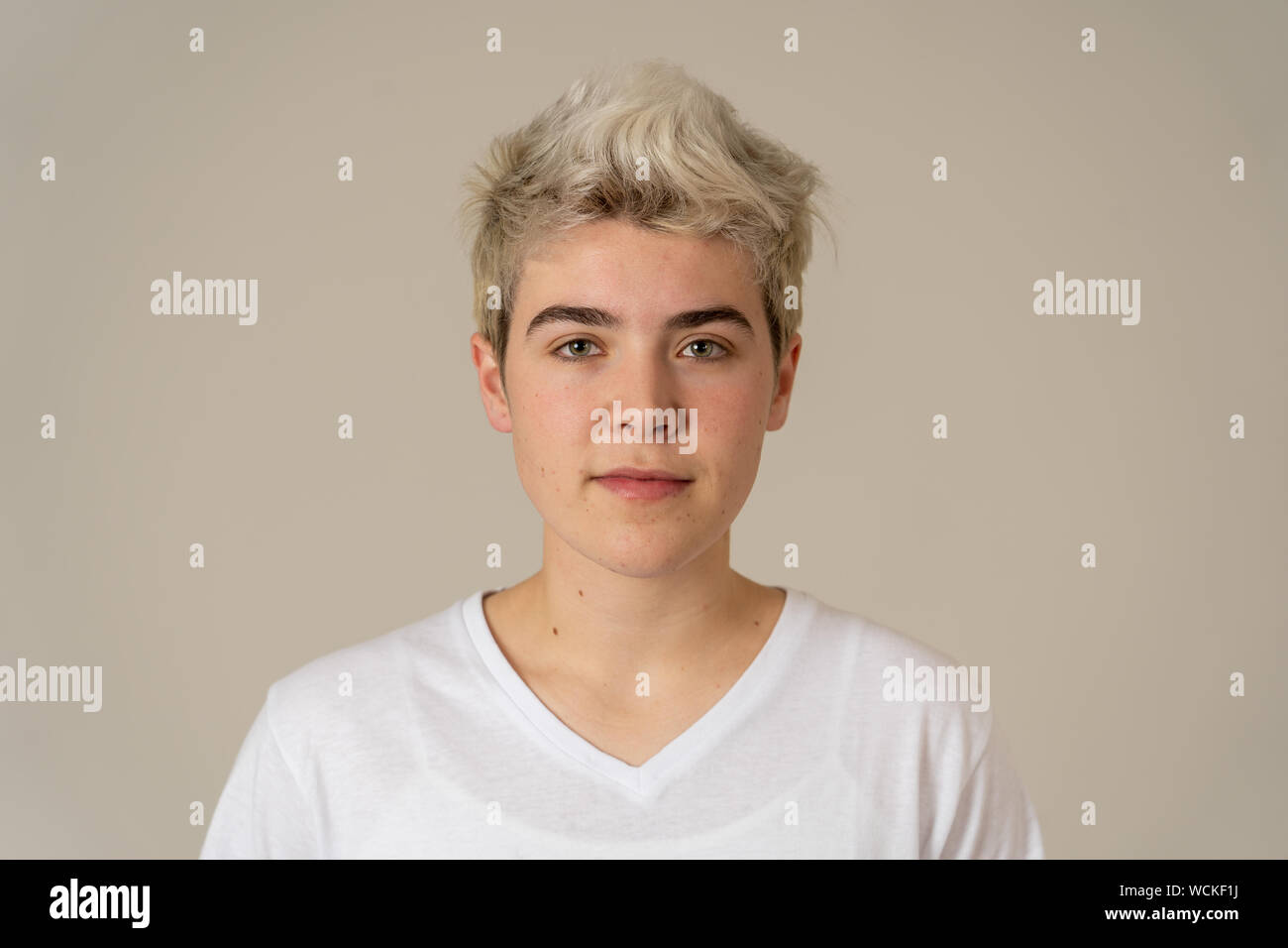 Close up portrait of young transgender teenager male with natural and ...