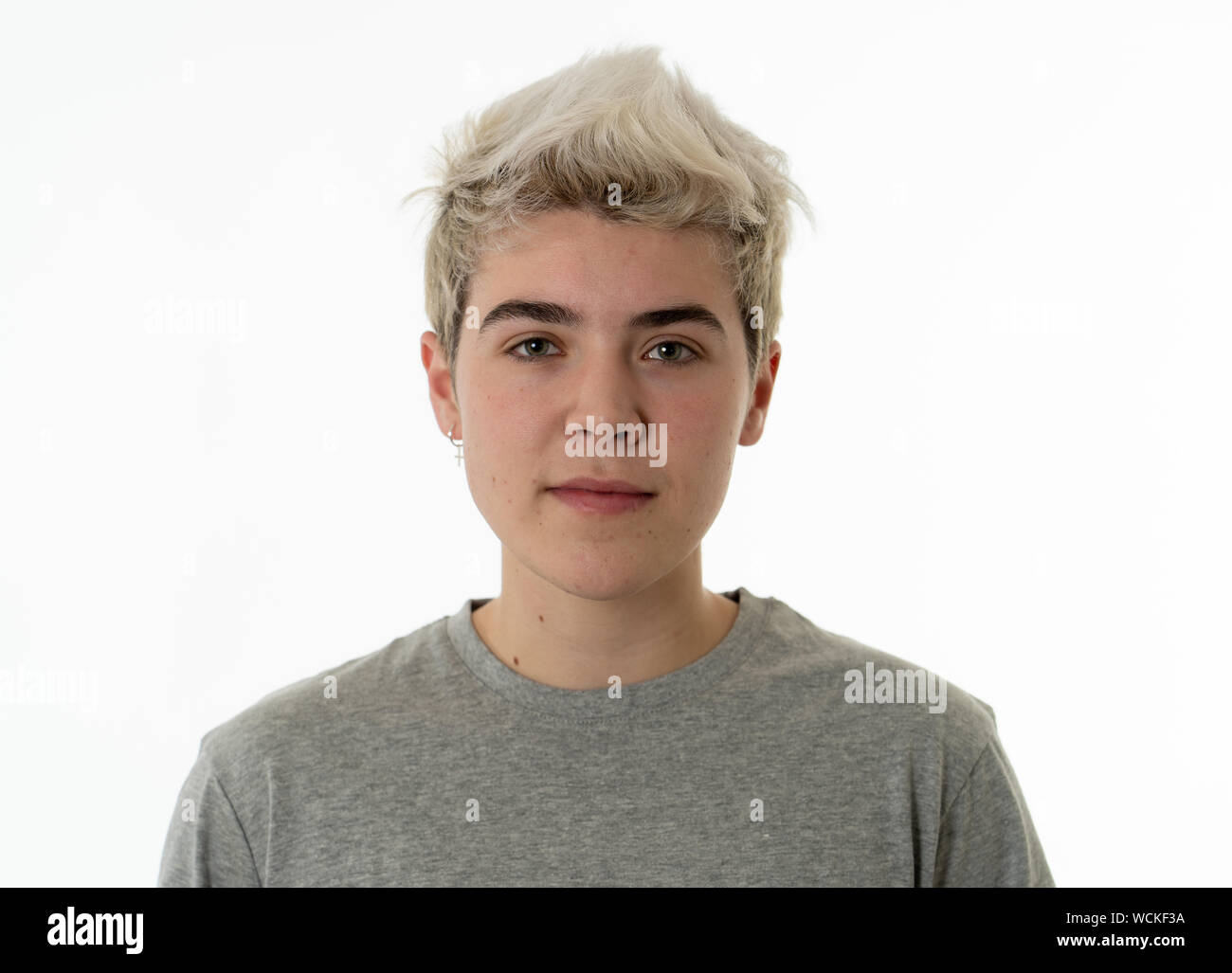 Close up portrait of young transgender teenager male with natural and ...