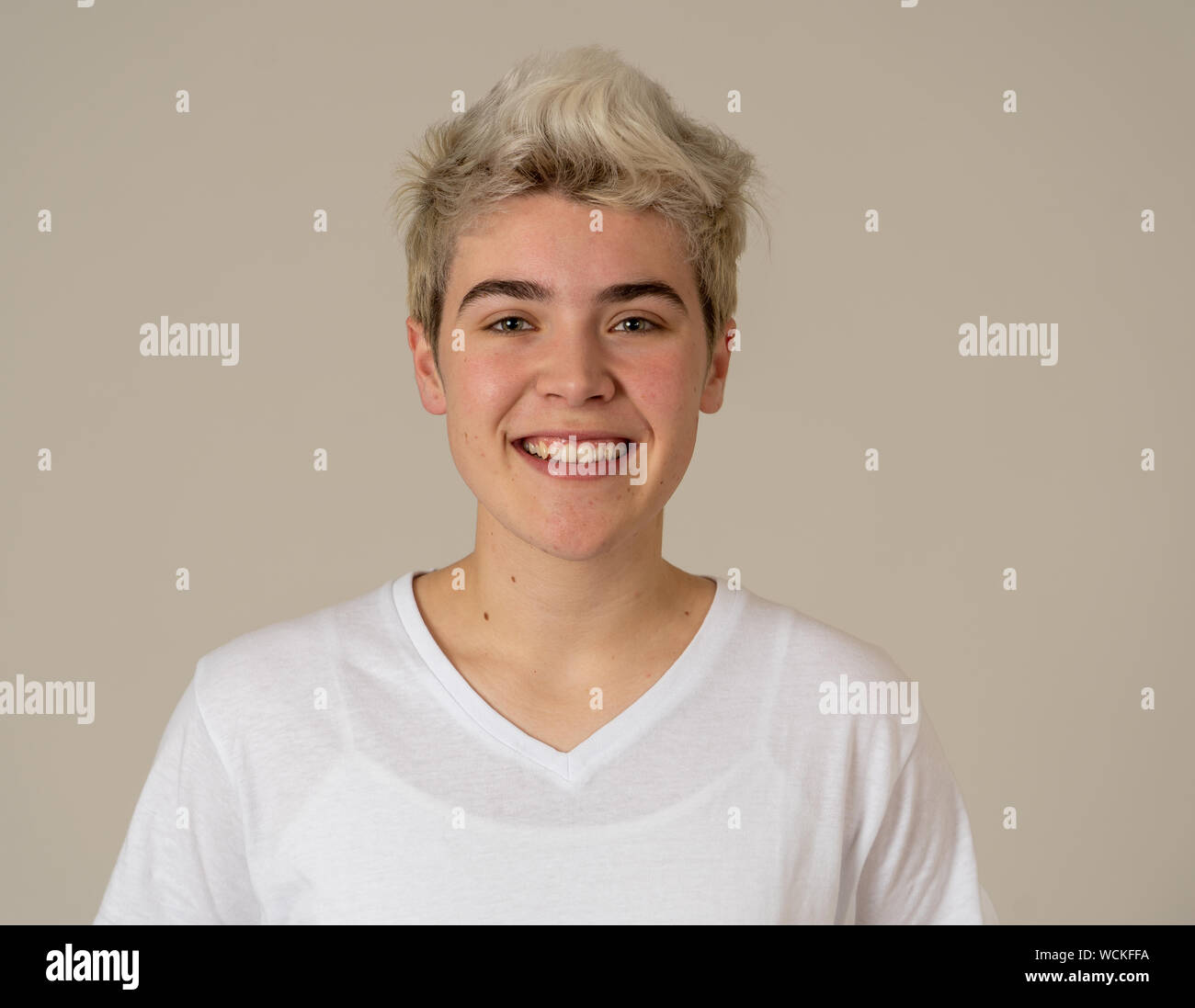 Portrait of handsome young transgender teenager man with beautiful ...