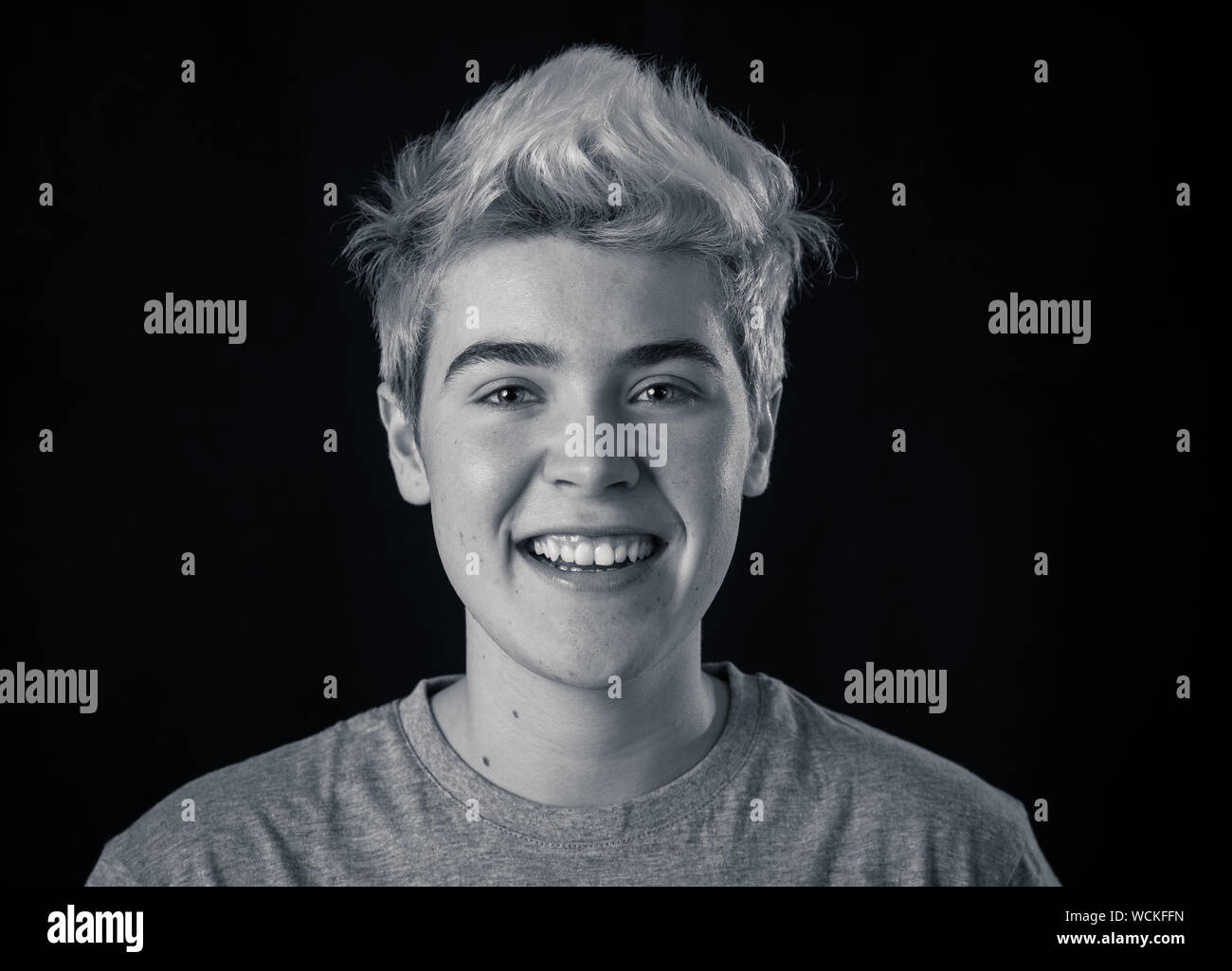 Portrait of handsome young transgender teenager man with beautiful ...