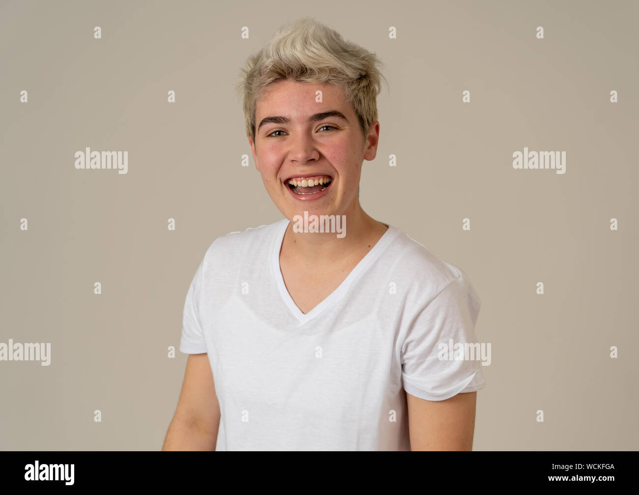 Portrait of handsome young transgender teenager man with beautiful ...