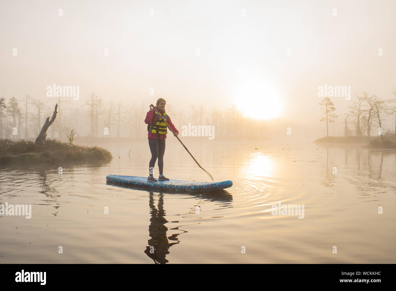 Atmospheric landscape. Fog over swamp. Sup-boarding Stock Photo - Alamy