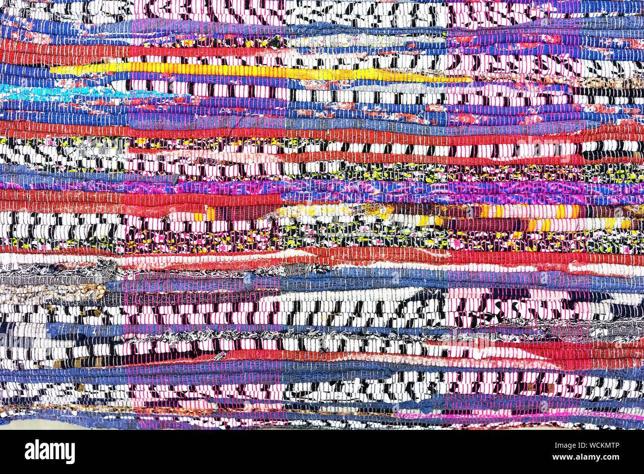 Rug of pieces of cloth. Texture and background of patchwork carpet ...