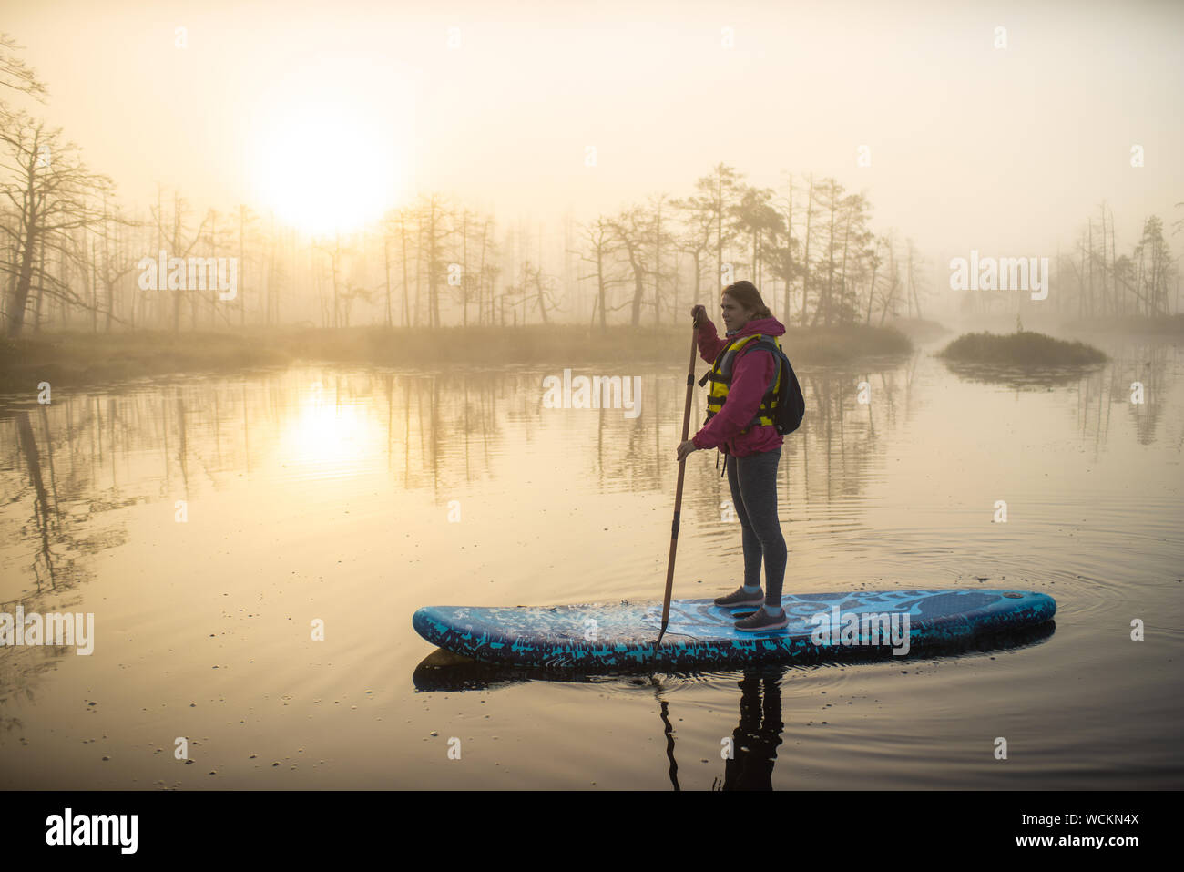 Atmospheric landscape. Fog over swamp. Sup-boarding Stock Photo - Alamy