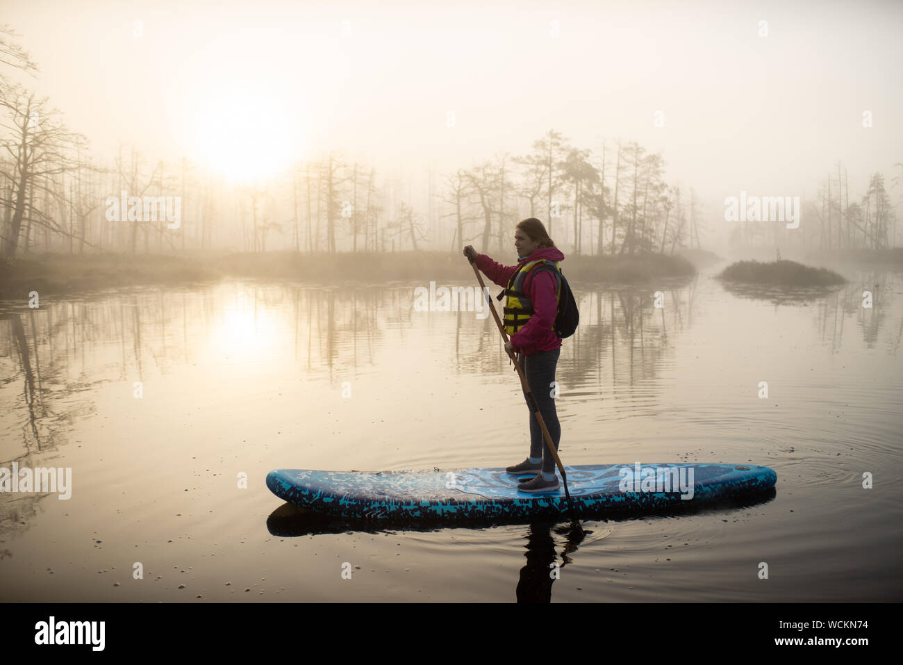 Atmospheric landscape. Fog over swamp. Sup-boarding Stock Photo - Alamy