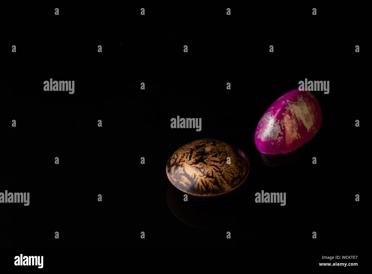 Modern Chocolate bonbons set on black Stock Photo - Alamy