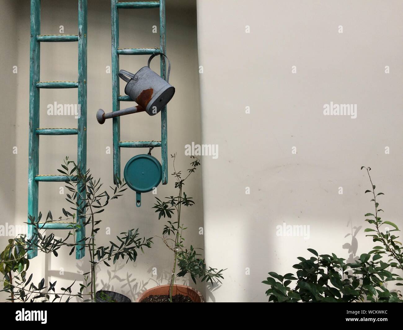 Ladder hanging on wall hi-res stock photography and images - Alamy