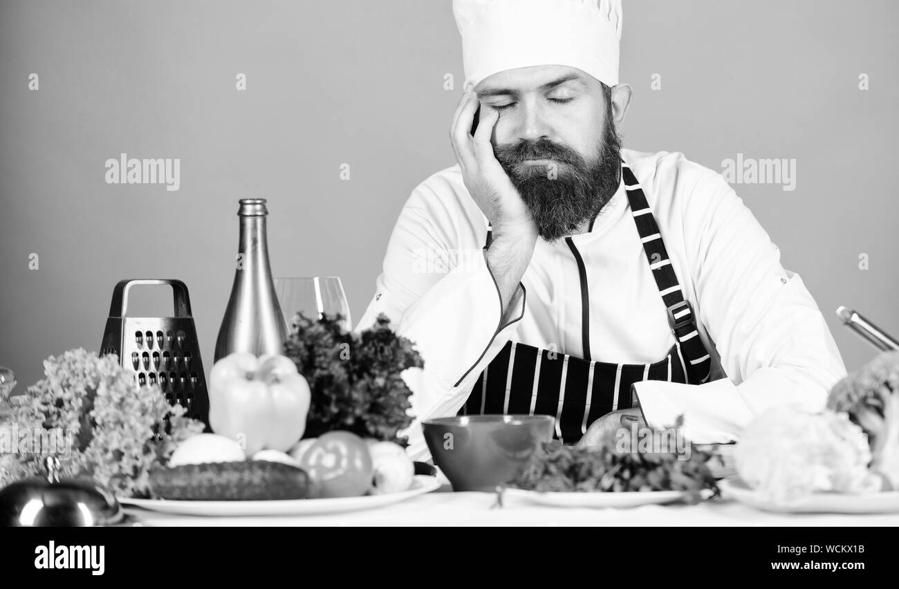 Bored chef lean on table at kitchen. Culinary inspiration. Hard day at ...