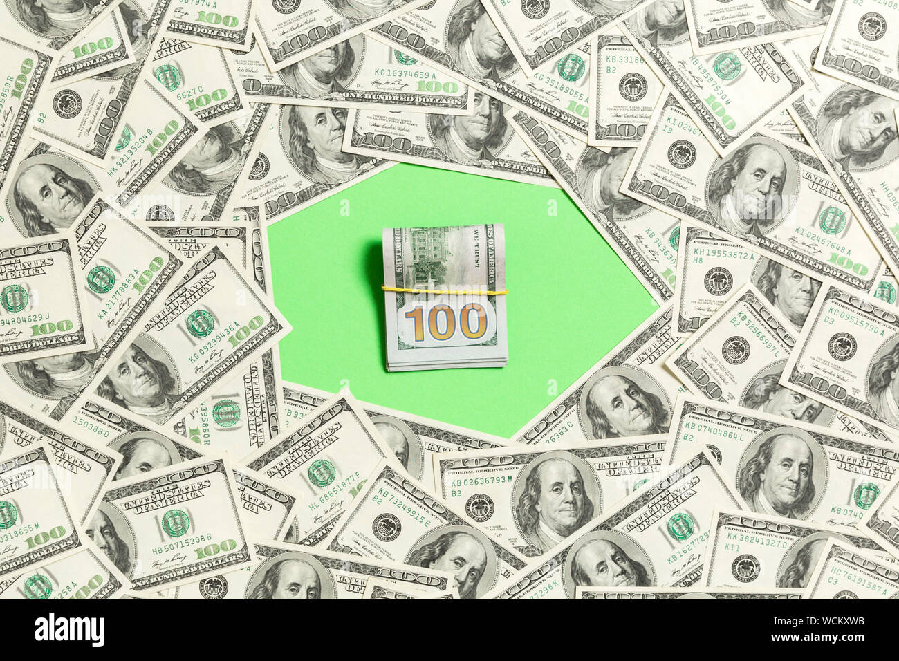 Frame of one hundred dollar bills with stack of money in the middle ...