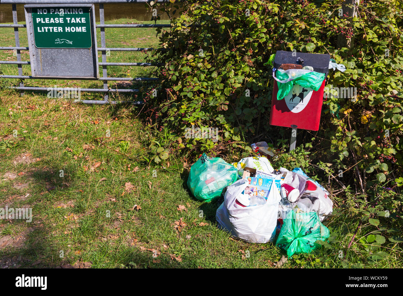 Bags of rubbish left by Wareham Common with please take litter home ...
