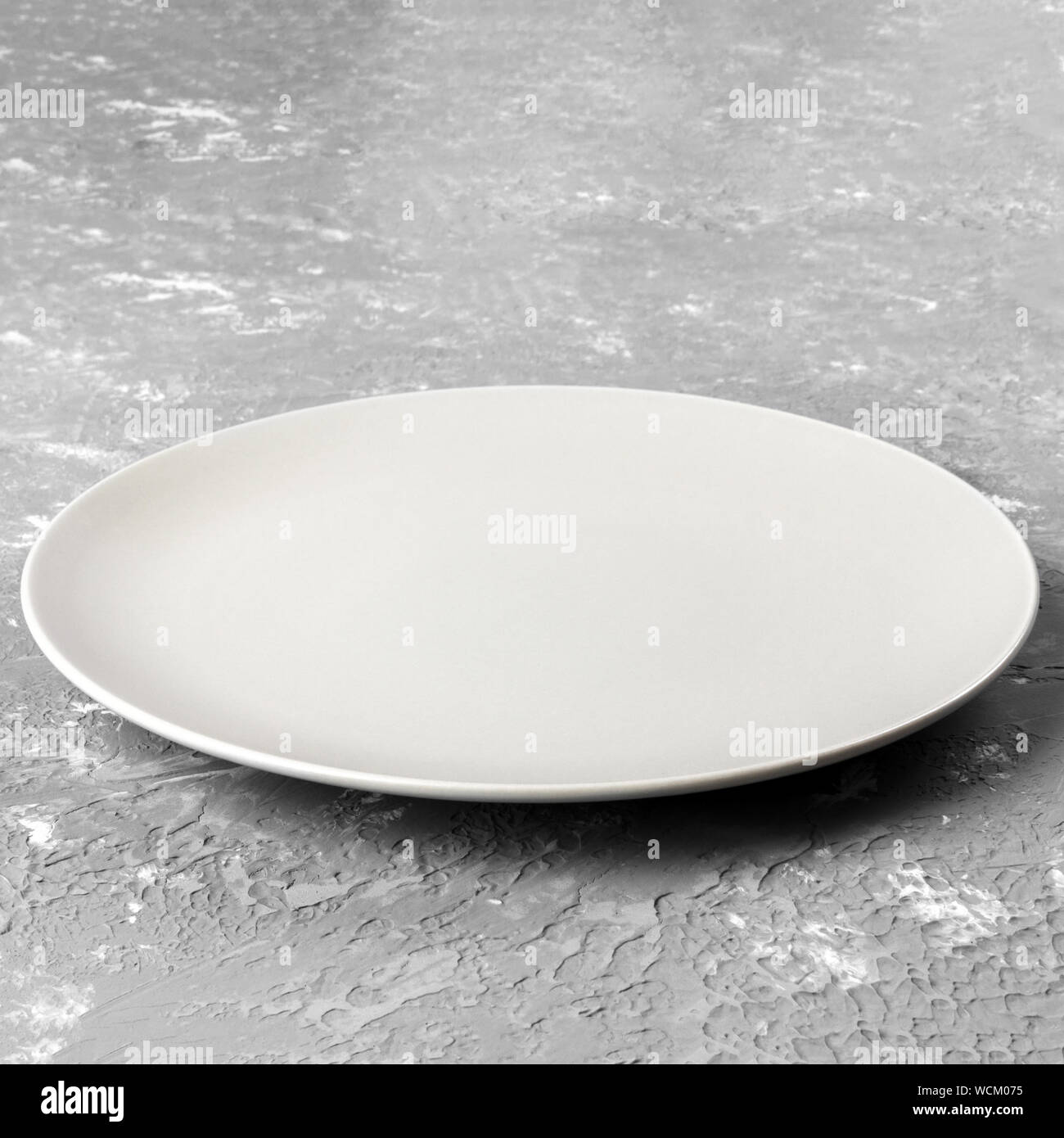 Perspective view. Empty white plate on wooden background Stock Photo ...