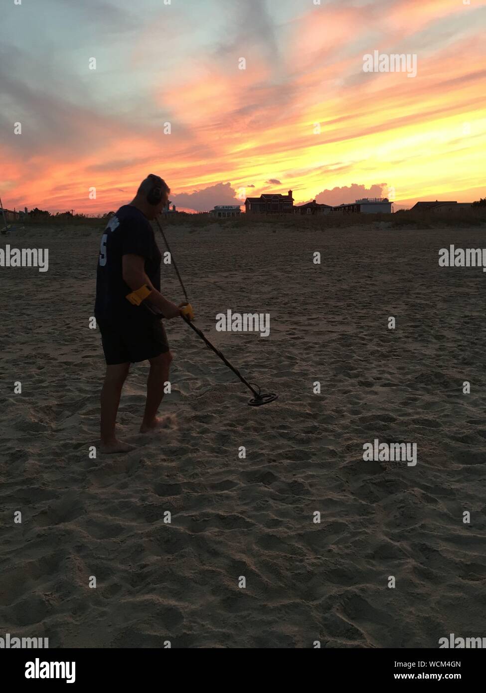Man holding metal detector hi-res stock photography and images - Alamy