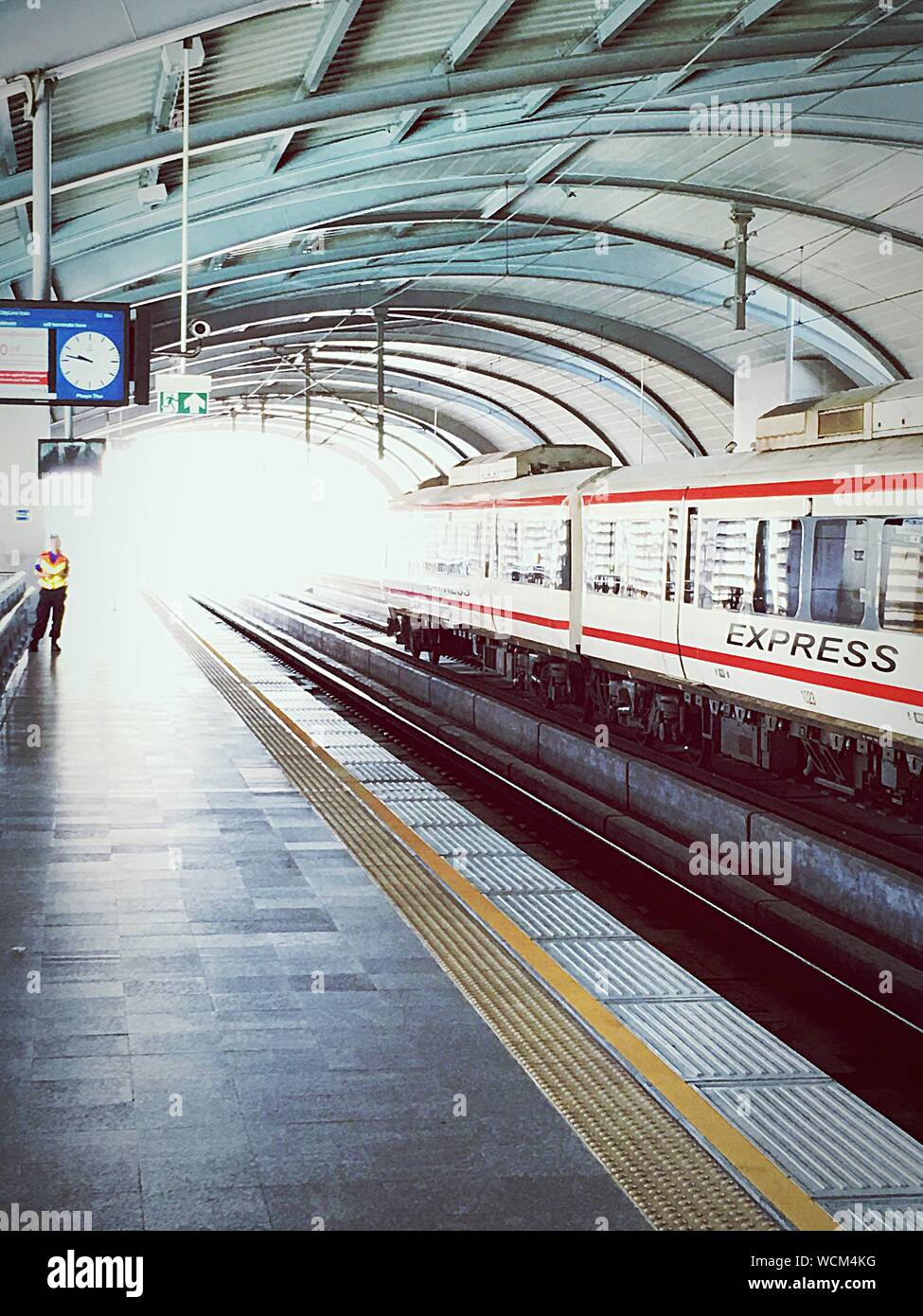 Man on station train hi-res stock photography and images - Alamy