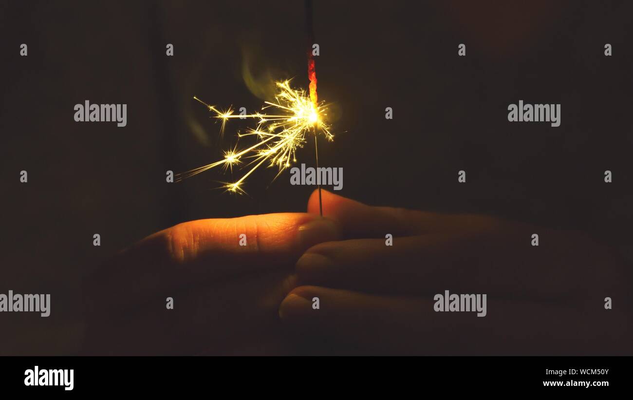 Hand lighting firework hi-res stock photography and images - Alamy