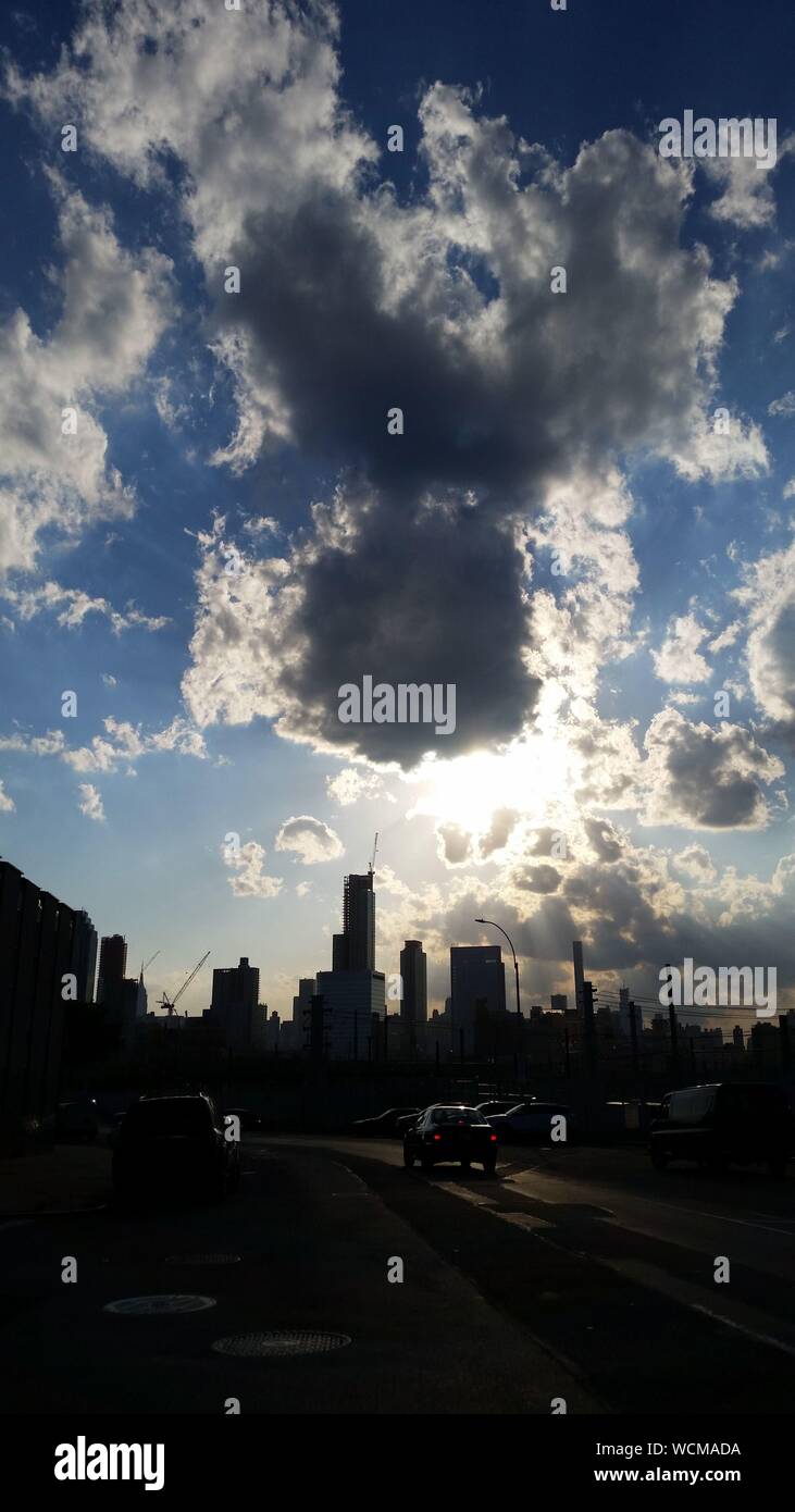 Cars On Street Against Skyline During Sunset Stock Photo - Alamy