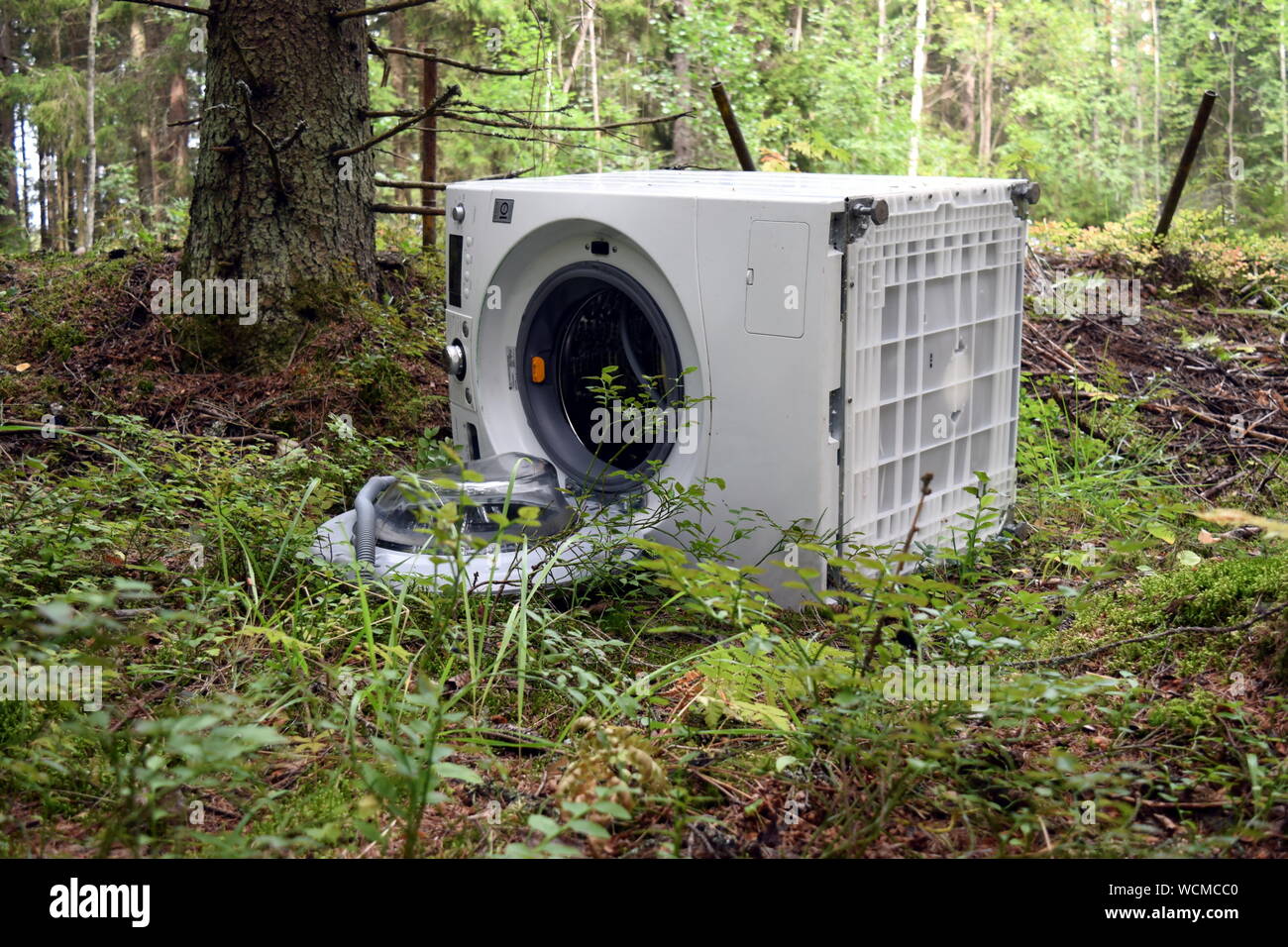Washing machine in a forest Stock Photo - Alamy