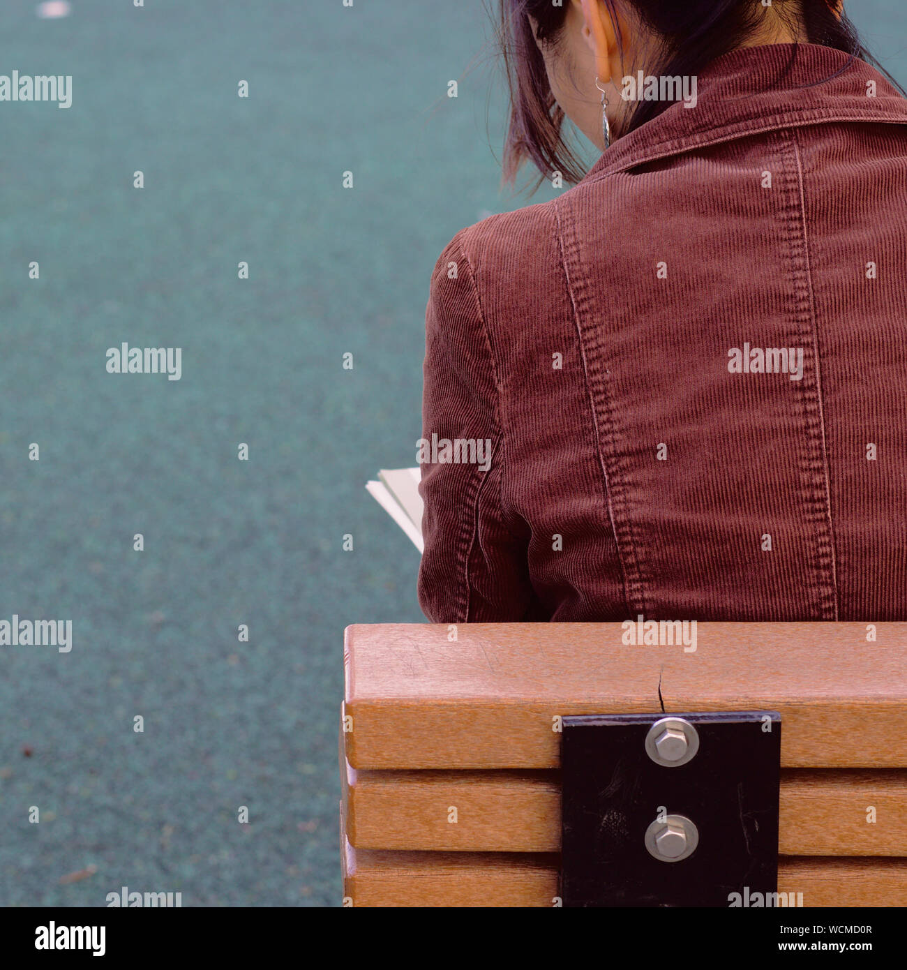 Woman sitting park bench hi-res stock photography and images - Alamy