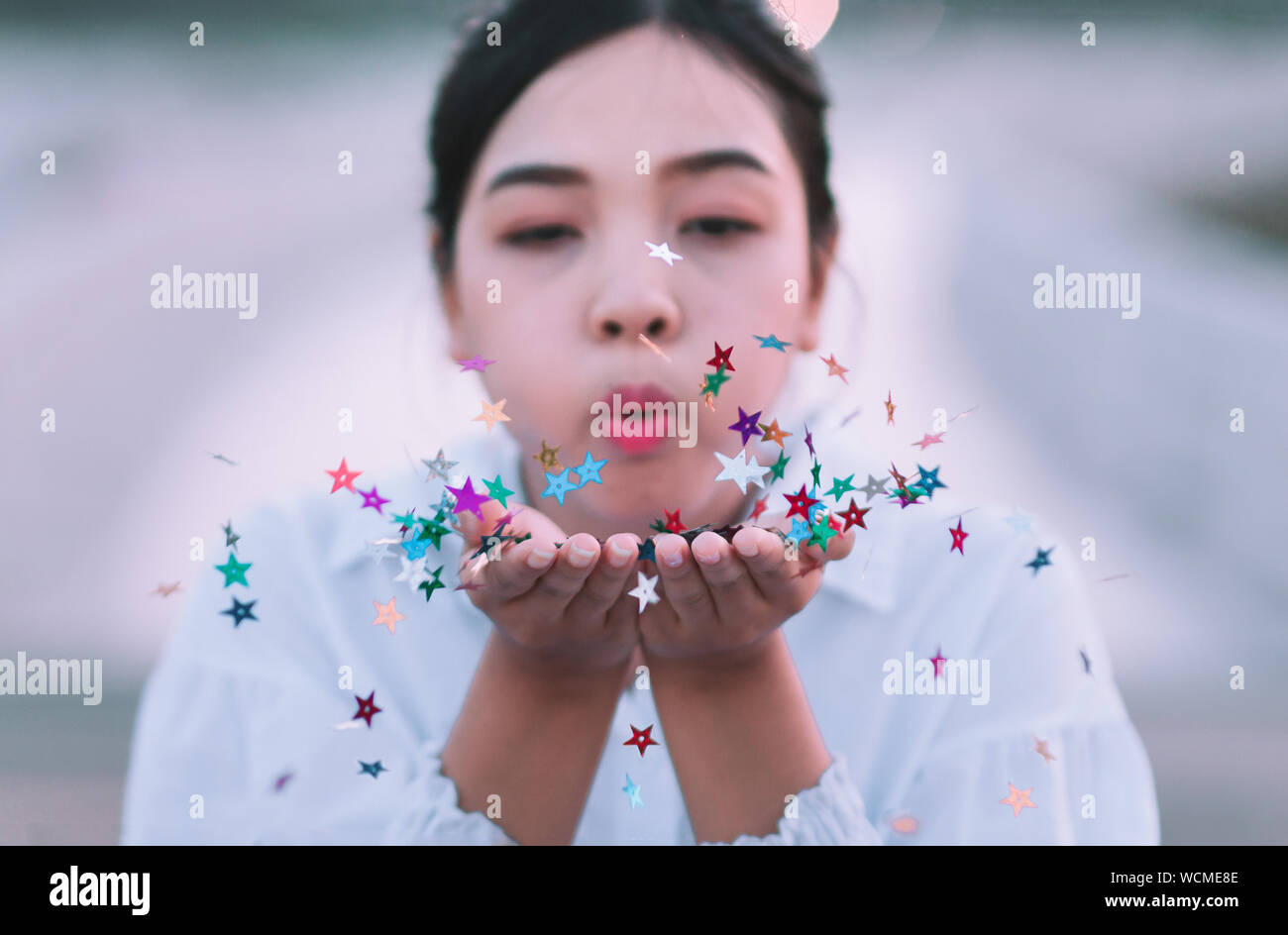Woman with confetti hi-res stock photography and images - Alamy