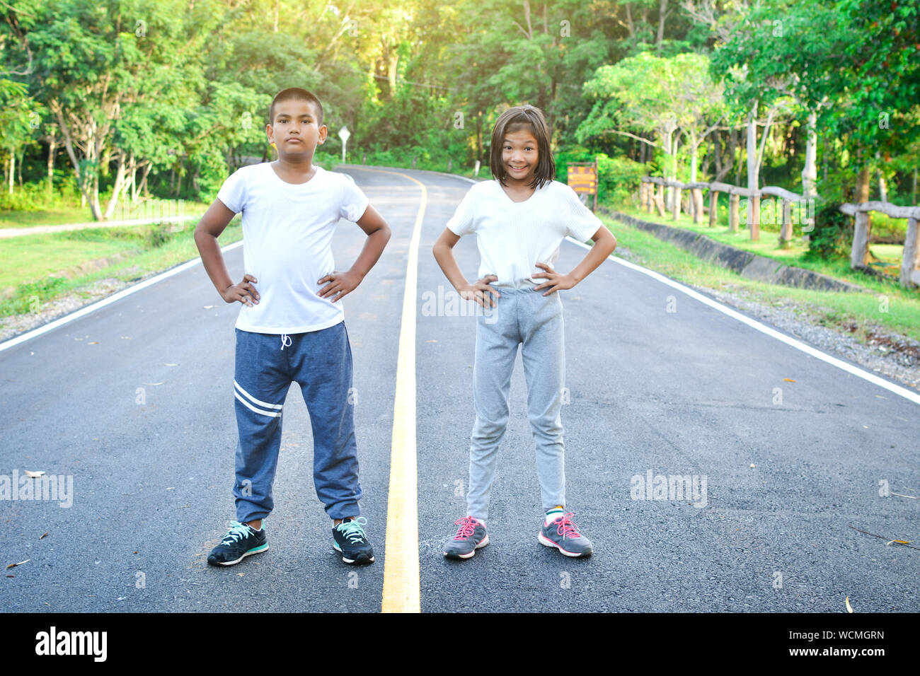 Girl standing on road hi-res stock photography and images - Alamy