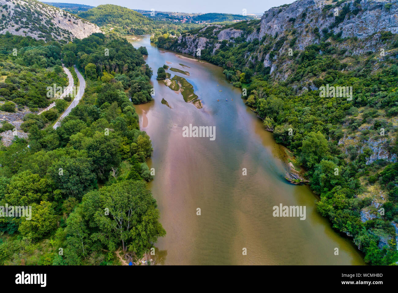 Aerial view of adventure team doing Kayaks on the cold waters of the ...