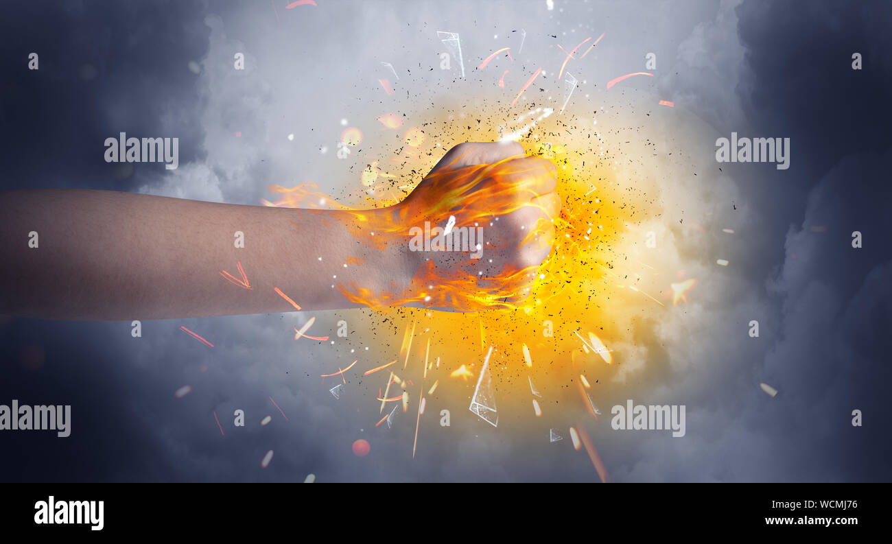 Hand hits strongly and makes fire beam around Stock Photo - Alamy