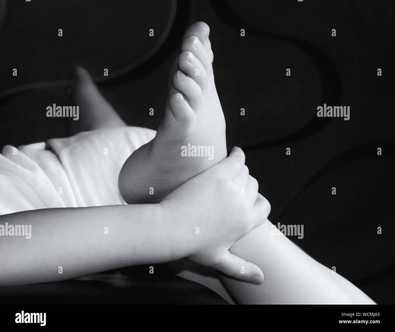 Holding leg hi-res stock photography and images - Alamy