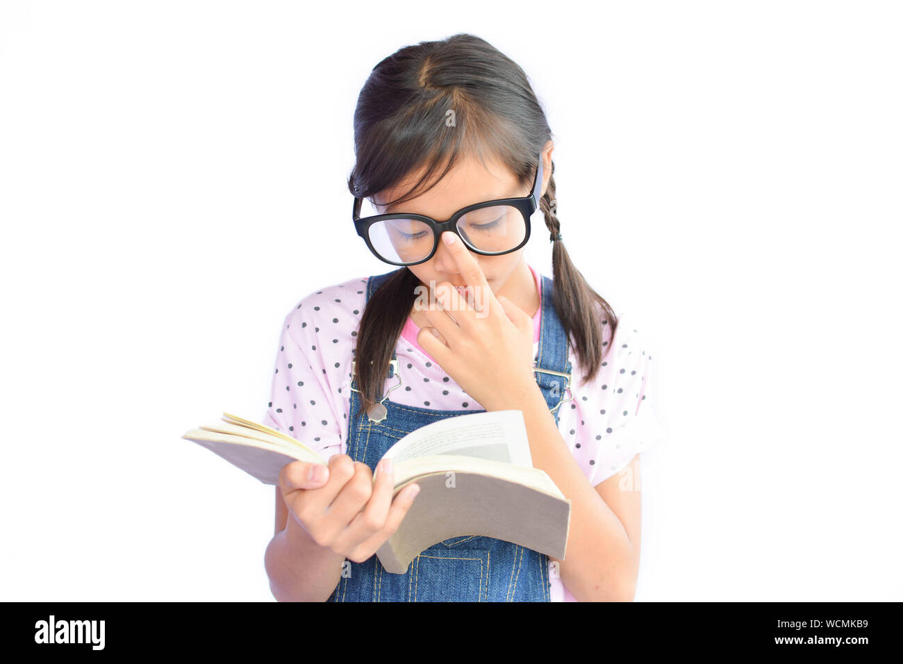 Girl with book hi-res stock photography and images - Alamy