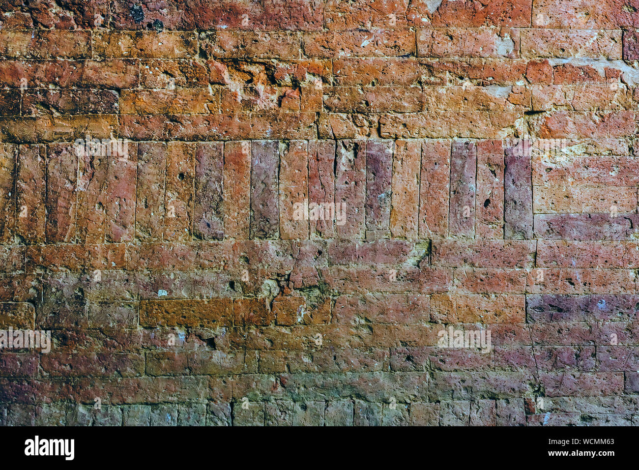 The ancient brick wall was neatly arranged and so strong that there was ...