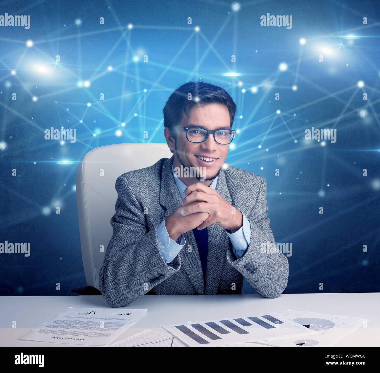 Manager in front of the office desk with networking concept Stock Photo ...