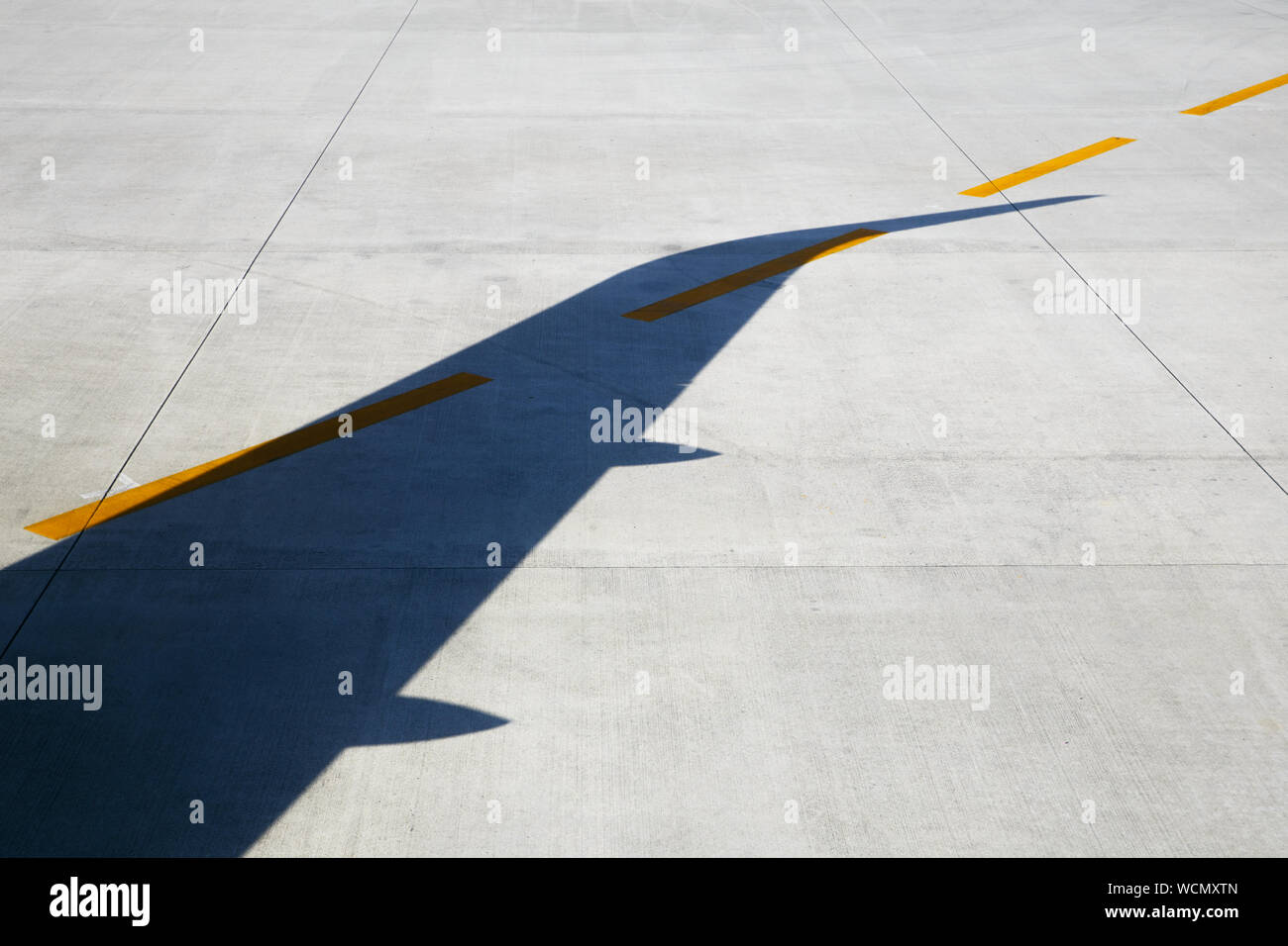Airplane shadow on runway hi-res stock photography and images - Alamy