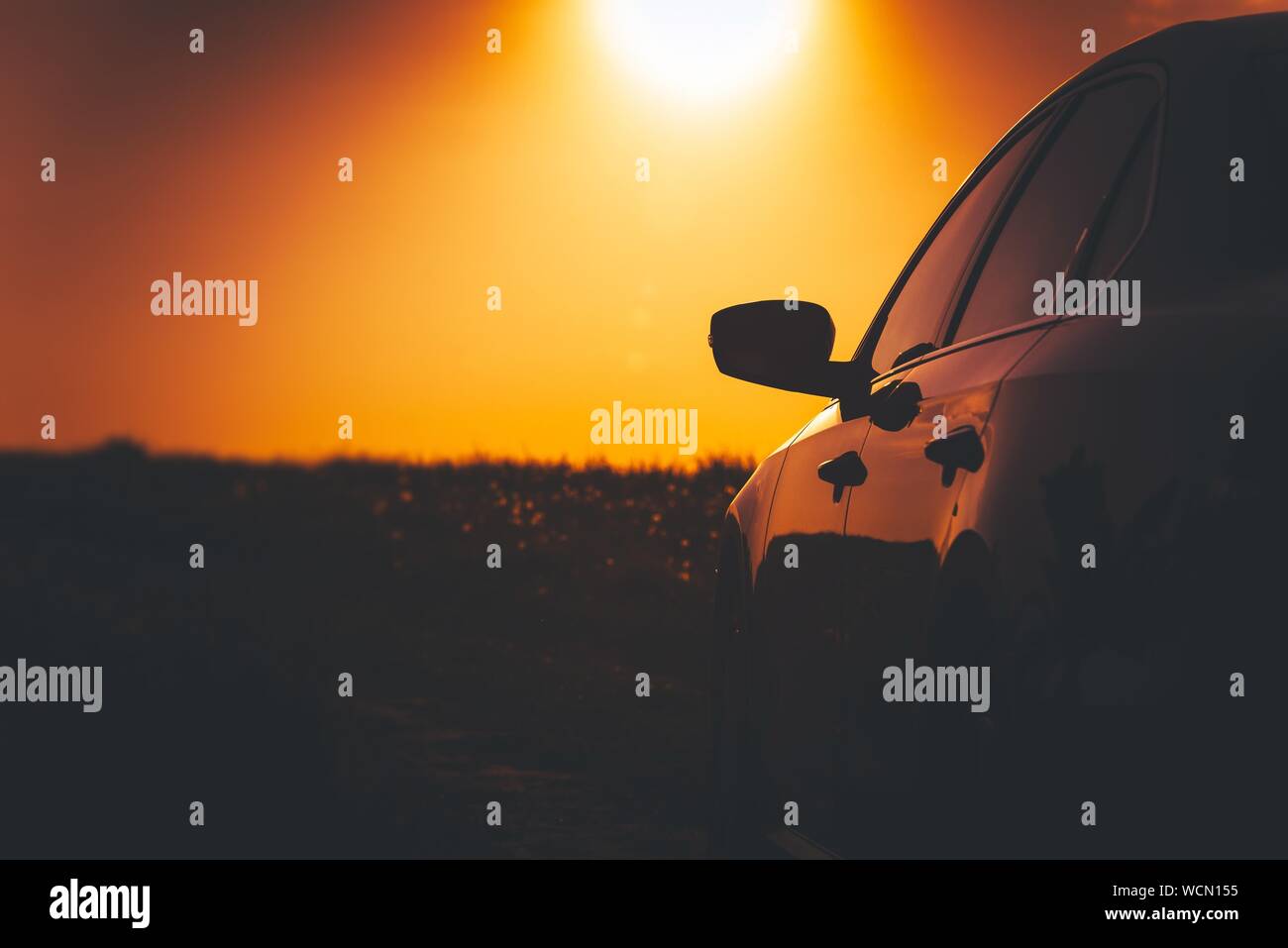 Car at sunset hi-res stock photography and images - Alamy