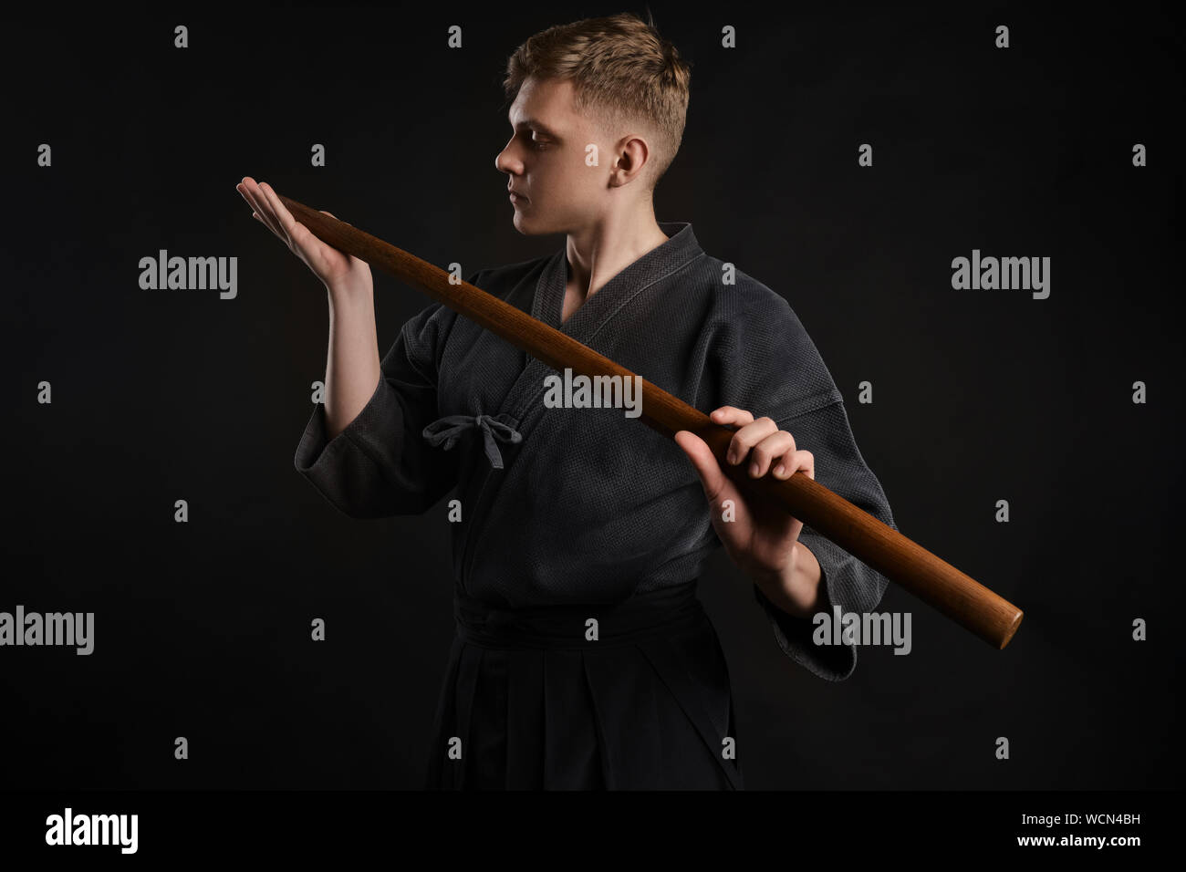 Strong Kendo fighter wearing in a traditional japanese kimono is ...