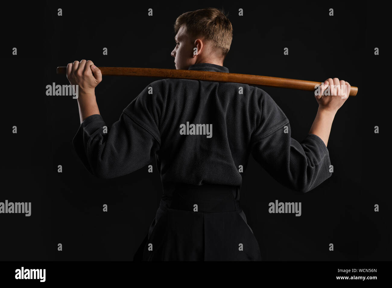 Experienced Kendo fighter wearing in a traditional japanese kimono is ...