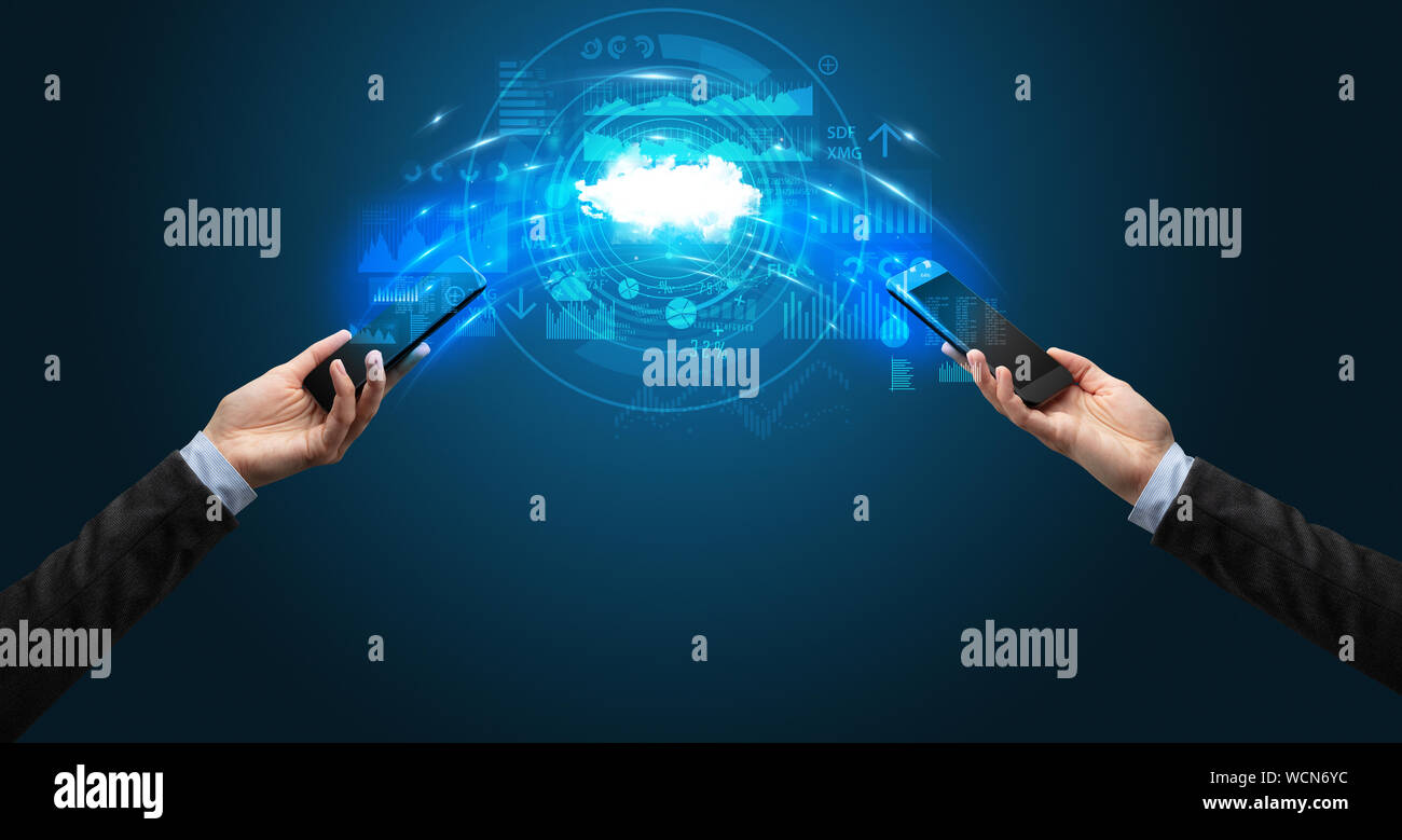 Two mobile phones syncing through the cloud Stock Photo - Alamy