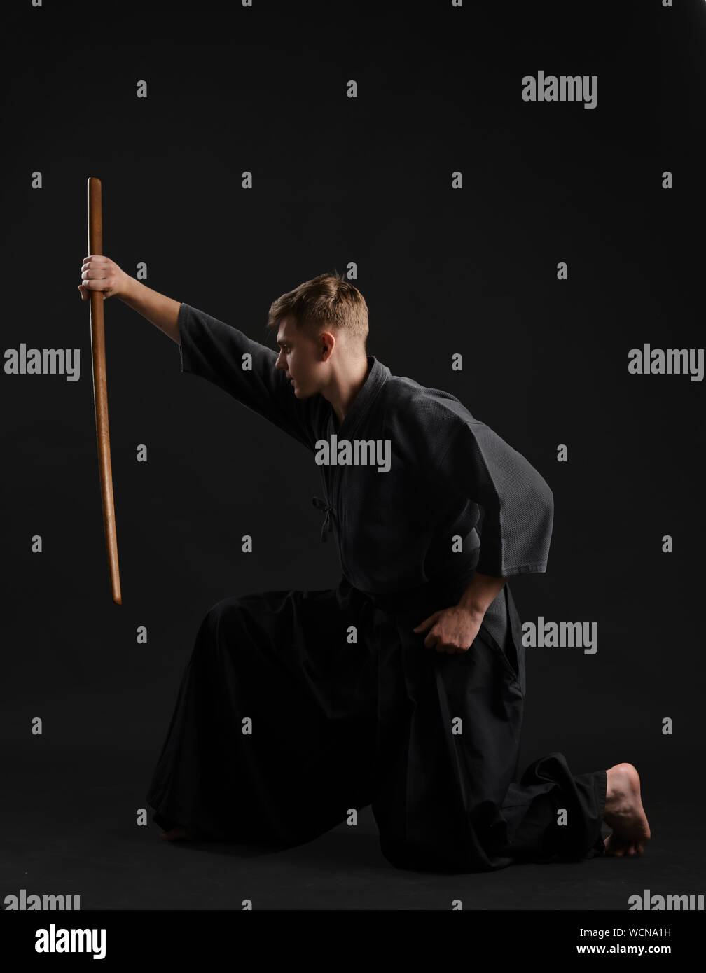Proficient Kendo guru wearing in a traditional japanese kimono is ...