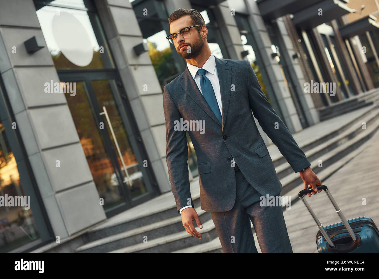 Man walking away suit hi-res stock photography and images - Alamy