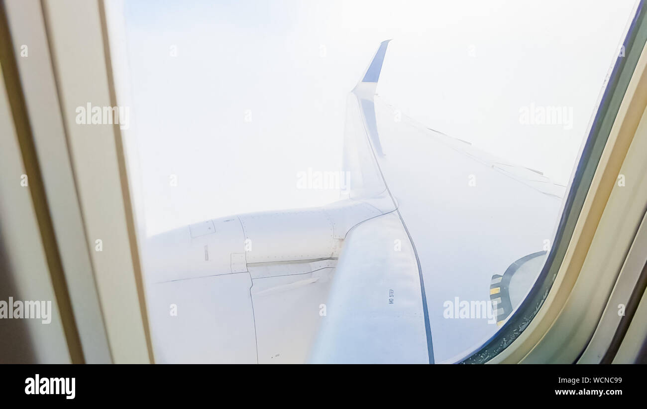 View from the window seat of commercial passenger airplane Stock Photo ...
