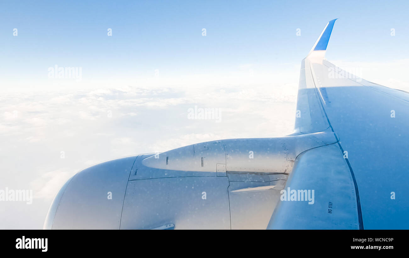 View from the window seat of commercial passenger airplane Stock Photo ...