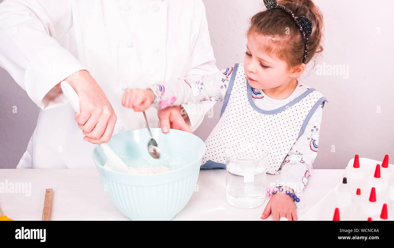 Step by step. Mixing royal icing to decorate sugar cookies Stock Photo ...