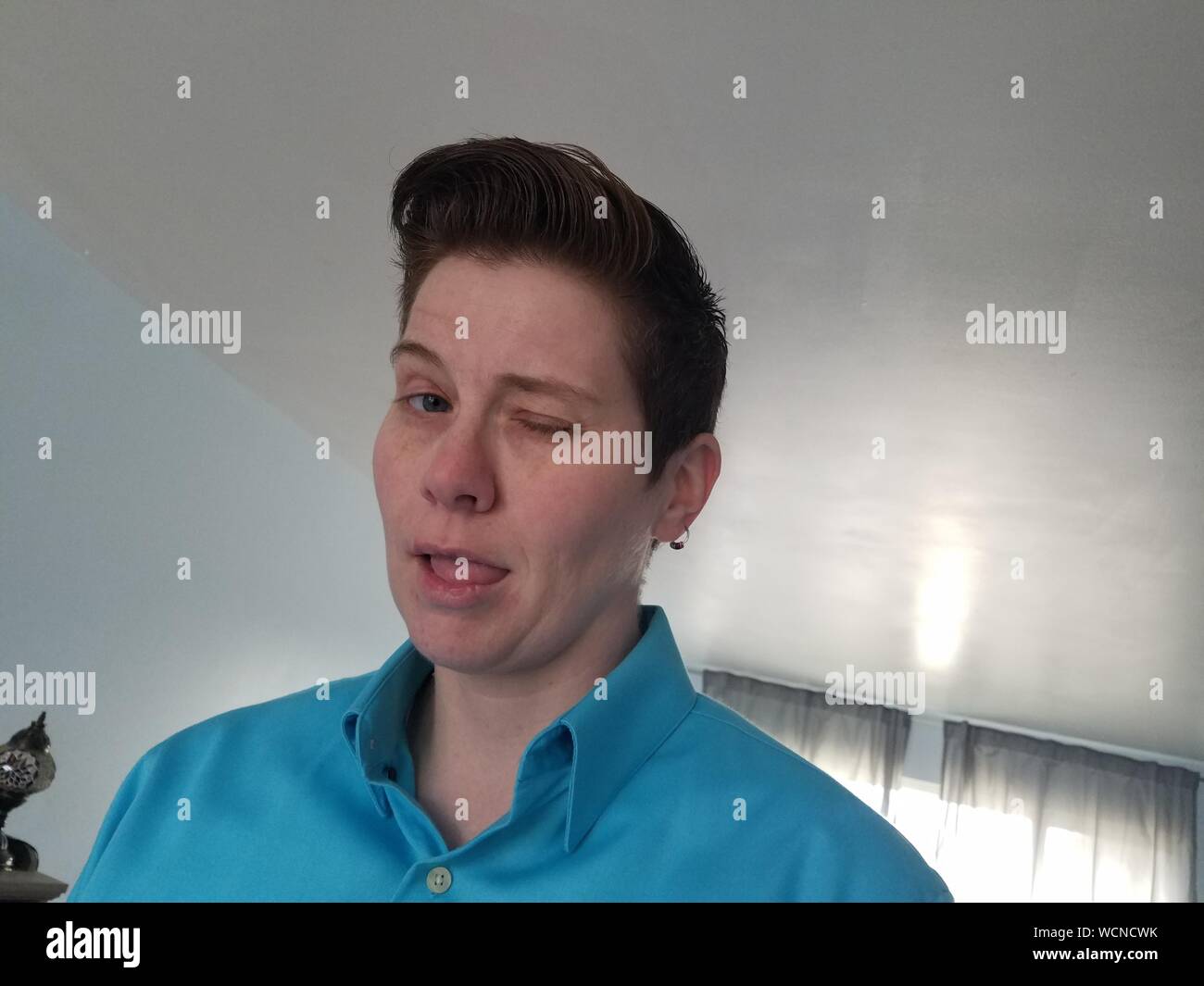 Woman winking close up hi-res stock photography and images - Alamy