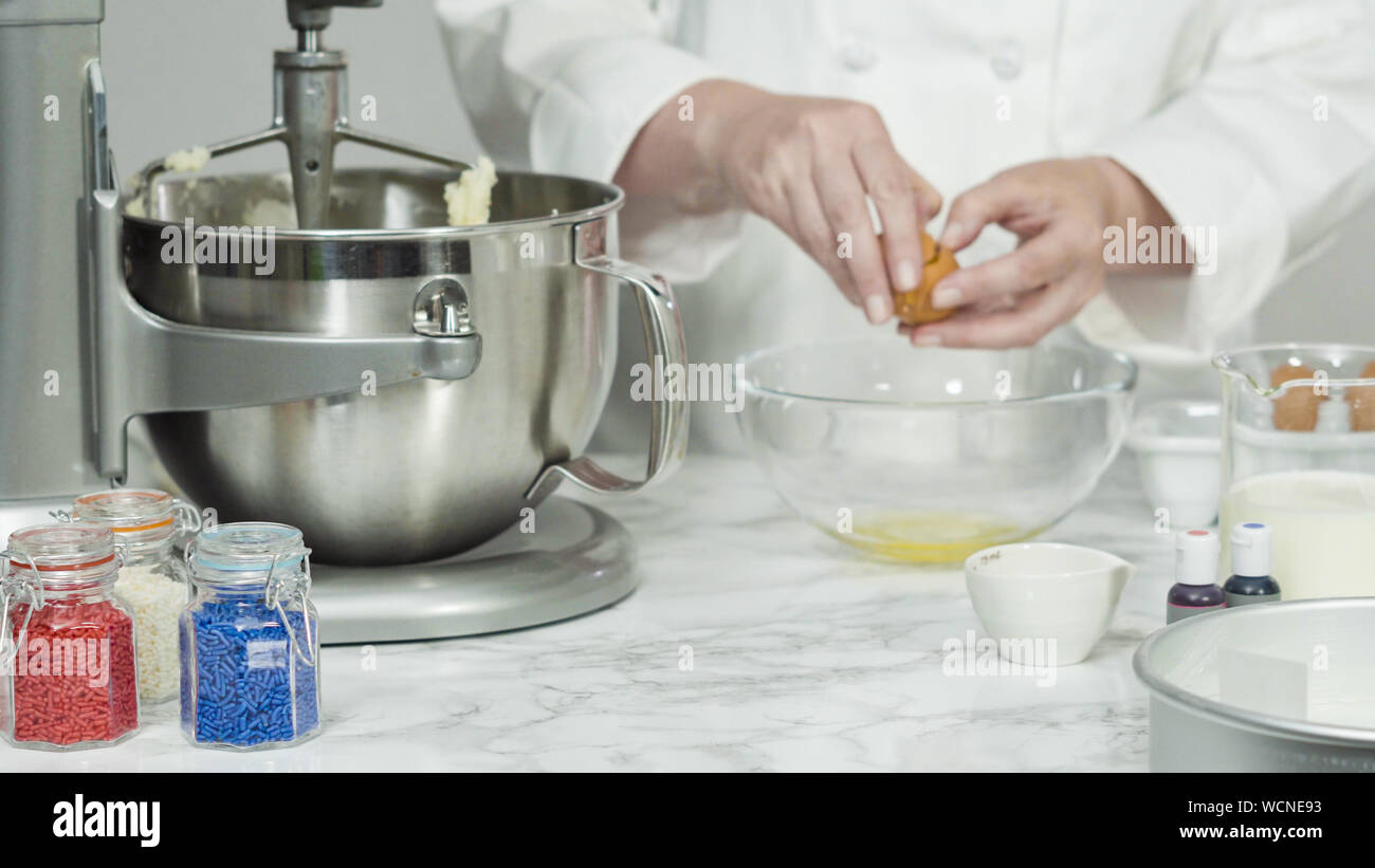 Step by step. Mixing ingredients in standing kitchen mixer to bake a ...