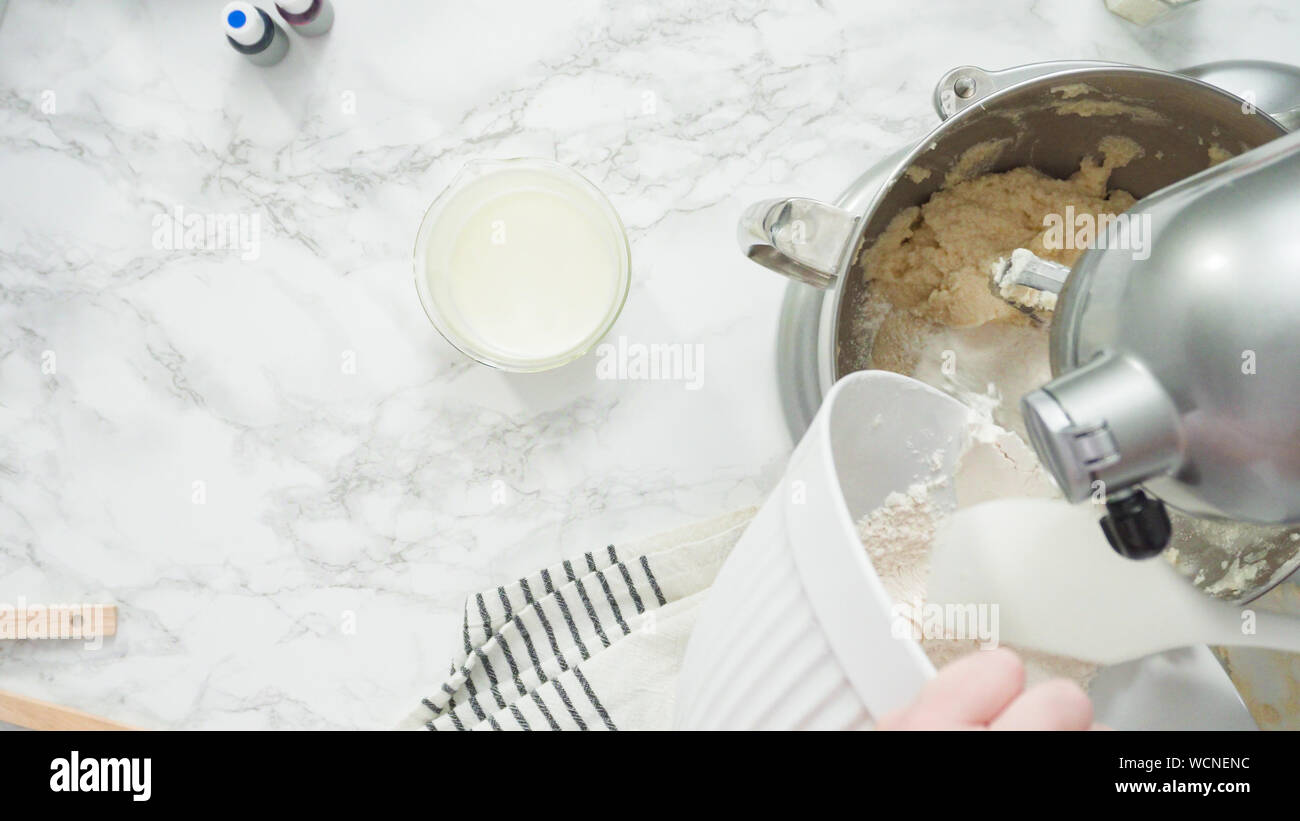 Step by step. Flat lay. Mixing ingredients in standing kitchen mixer to ...