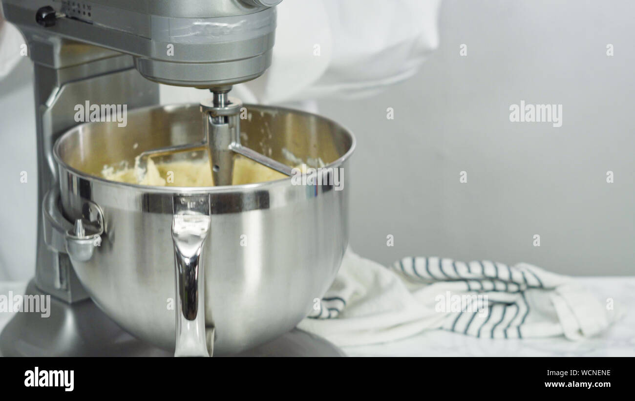 Step by step. Mixing ingredients in standing kitchen mixer to bake ...
