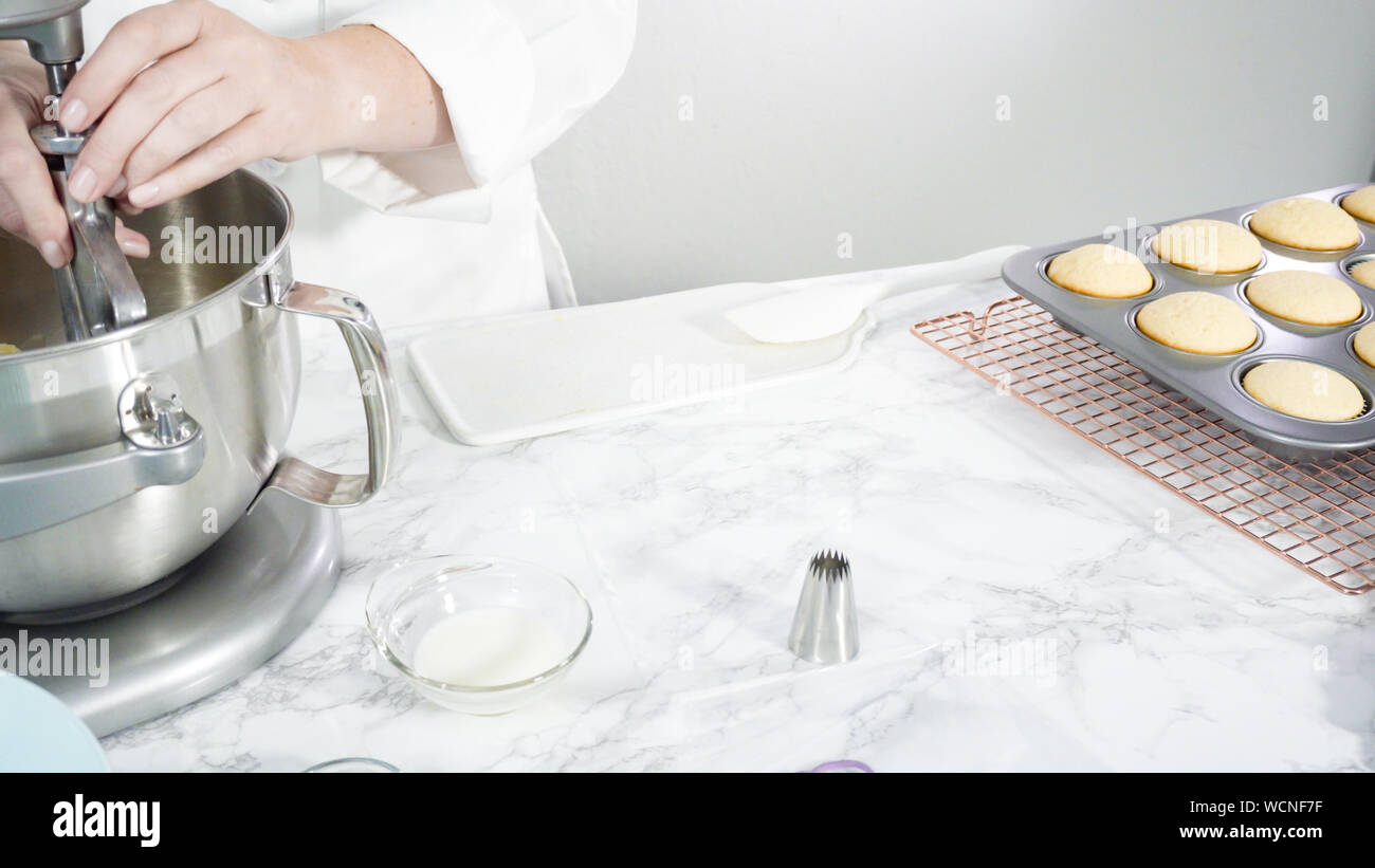 Step by step. Cooling freshly baked vanilla cupcakes on wire cooling ...