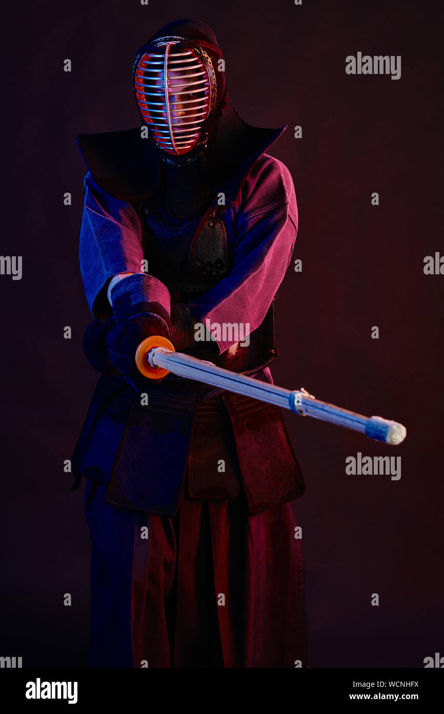 Experienced Kendo master wearing in an armor, traditional kimono and ...